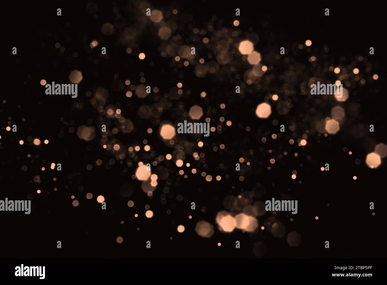 Peach fuzz blurred abstract bokeh lights on black background. Snowy ...