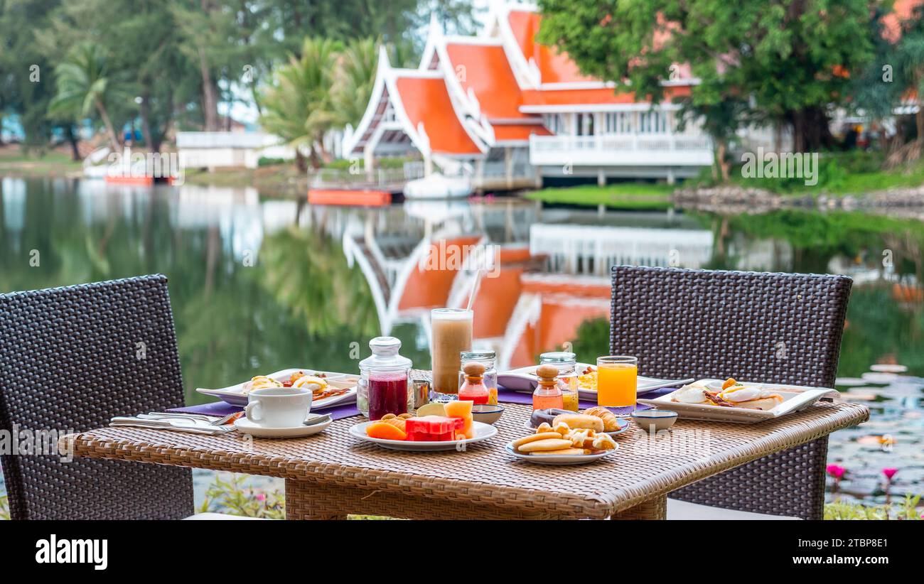 Outdoor breakfast arrangement at lakeside resort. Travel and leisure ...
