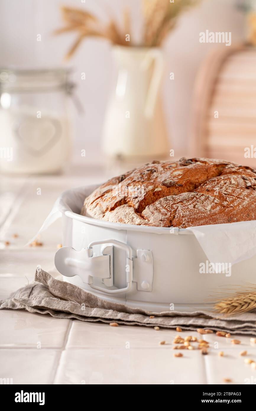 Multigrain loaf of round bread with grain and ears. Homemade bread ...