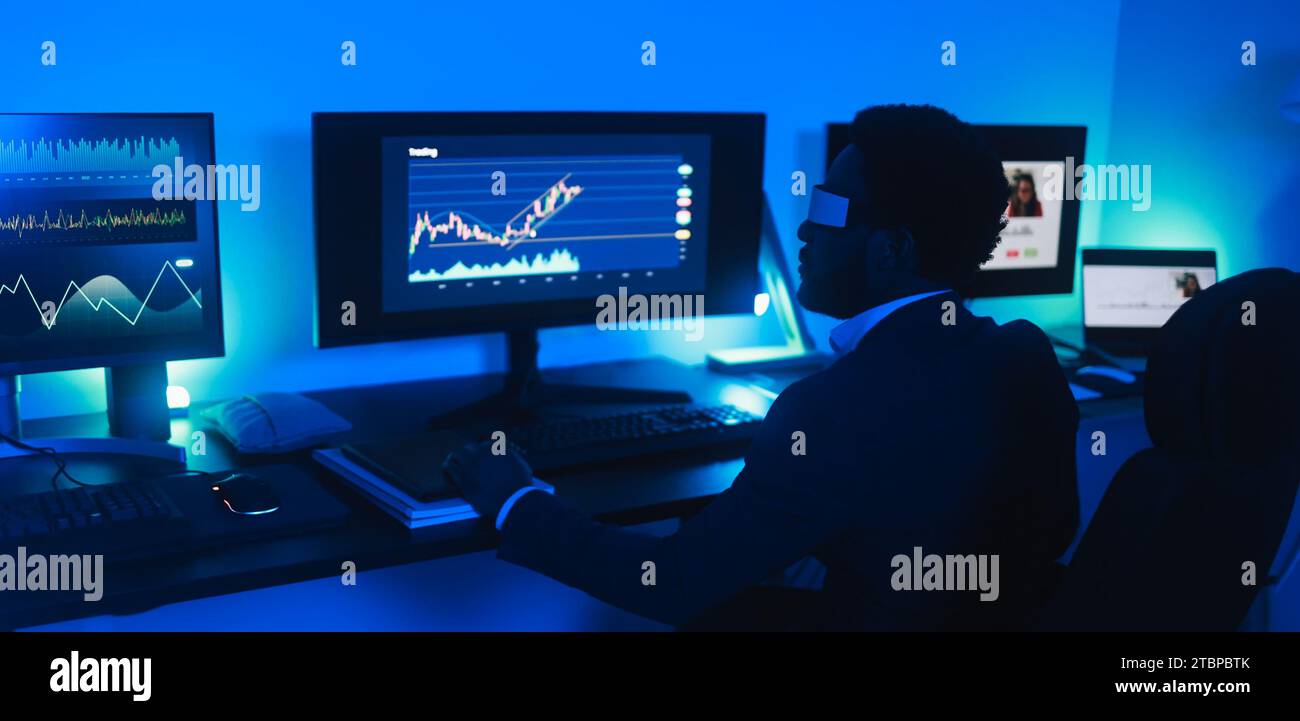 African man trader working inside office at night time wearing virtual ...