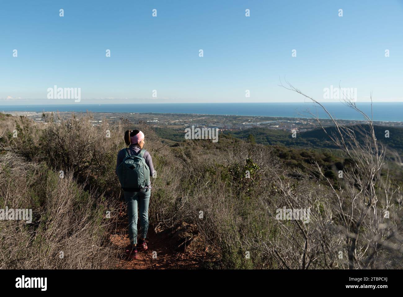 Woman contemplates the landscapes of the Garraf Natural Park while ...