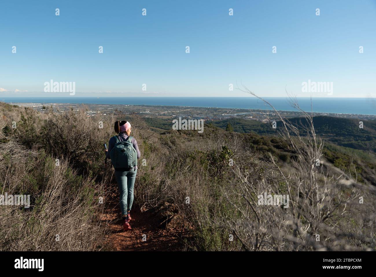 Woman contemplates the landscapes of the Garraf Natural Park while ...