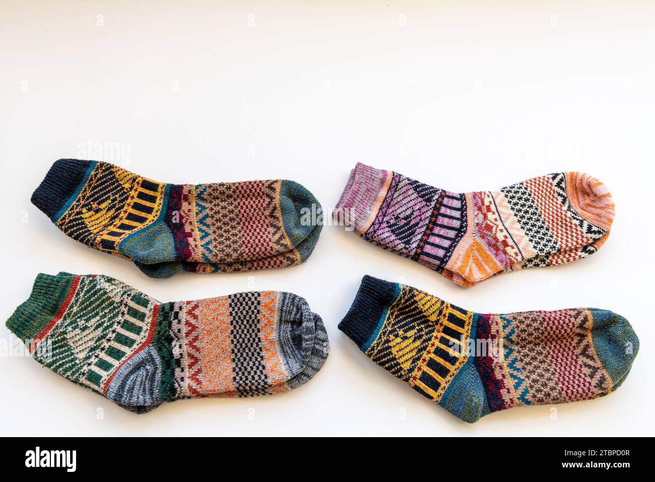 Four pairs of colourful Winter woollen socks of various patterns ...