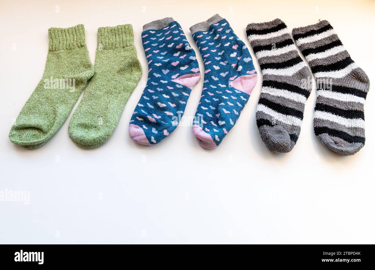 Various thick Winter socks arranged in a row isolated in white Stock ...