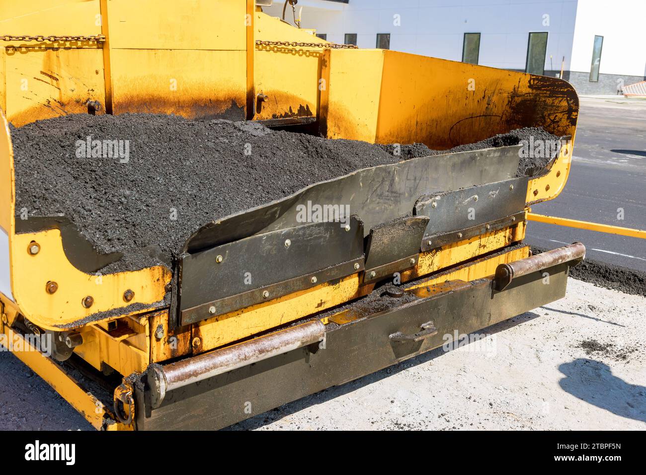 Construction of highway is carried out by pavement machine laying fresh ...
