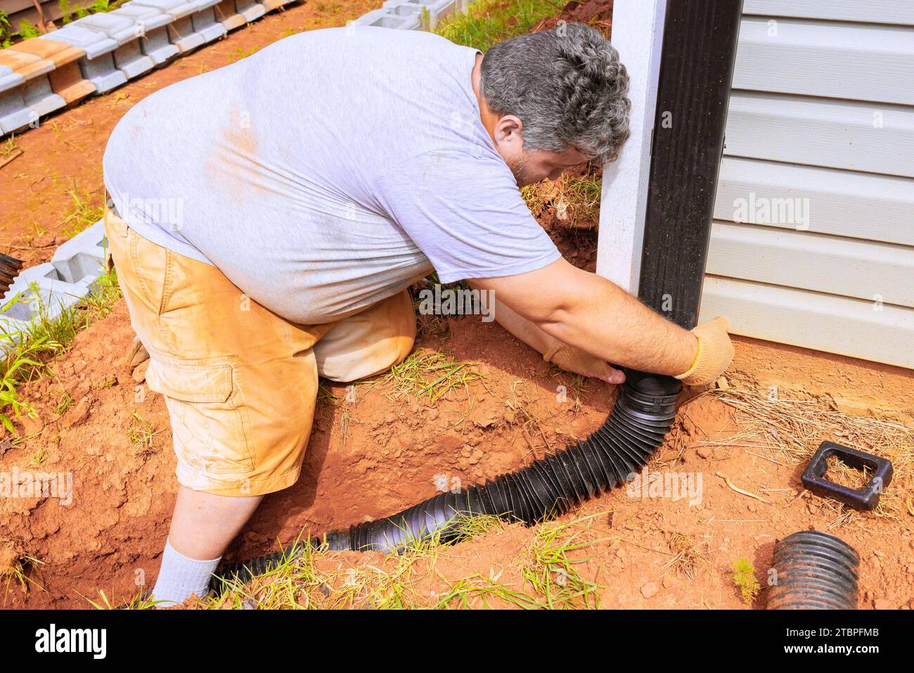 Installing connector downspout for flexible gutter extension drainage ...