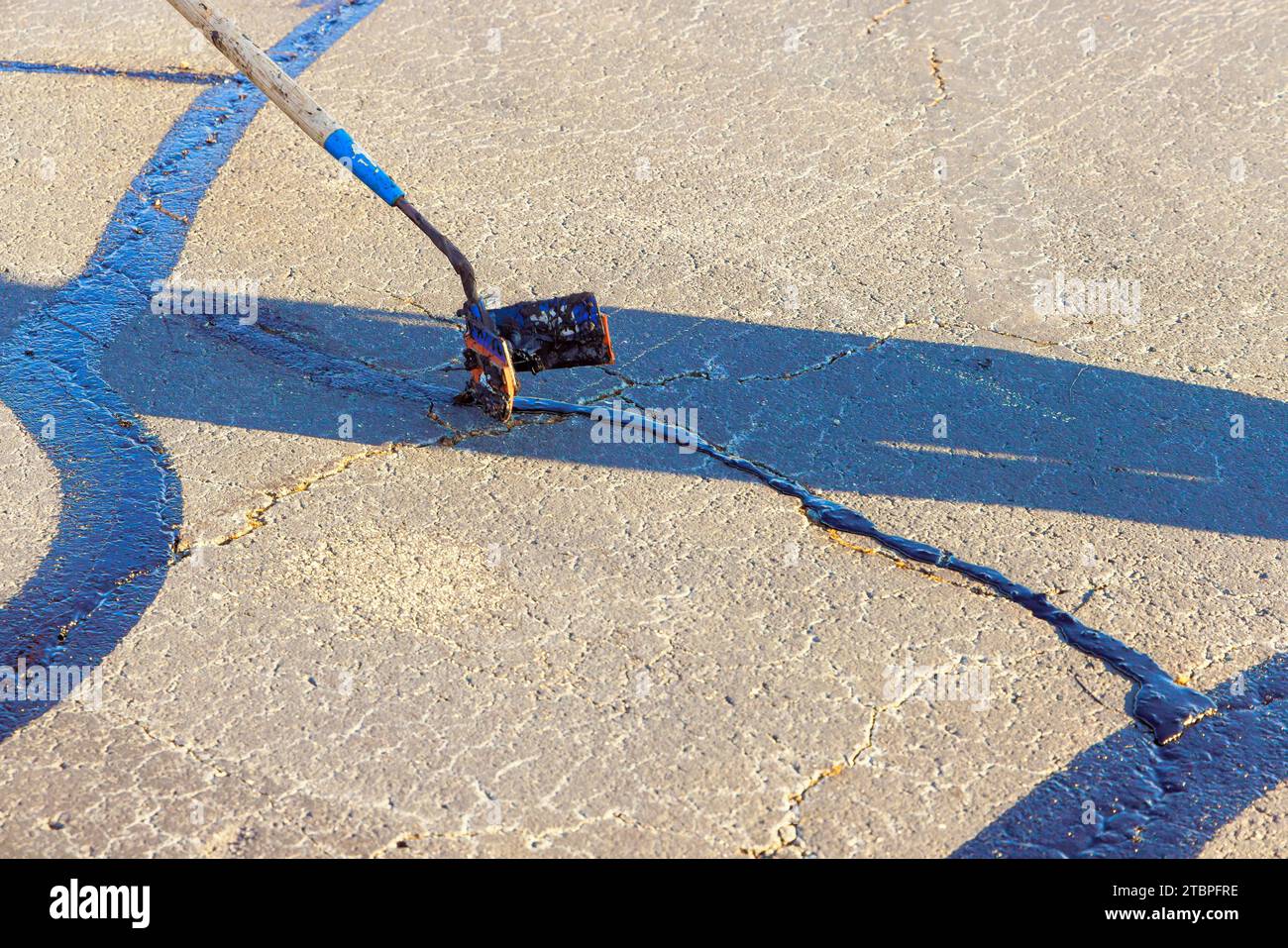 Course of worker patching are filled, asphalt cracks are sealed ...