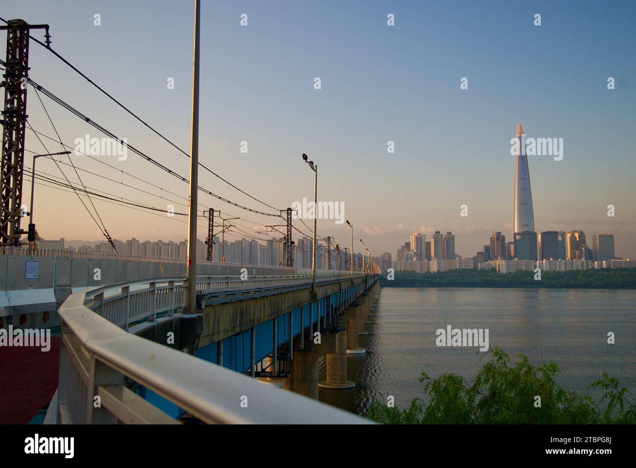 As dawn breaks over Seoul, the Jamsil Railroad Bridge stretches across ...