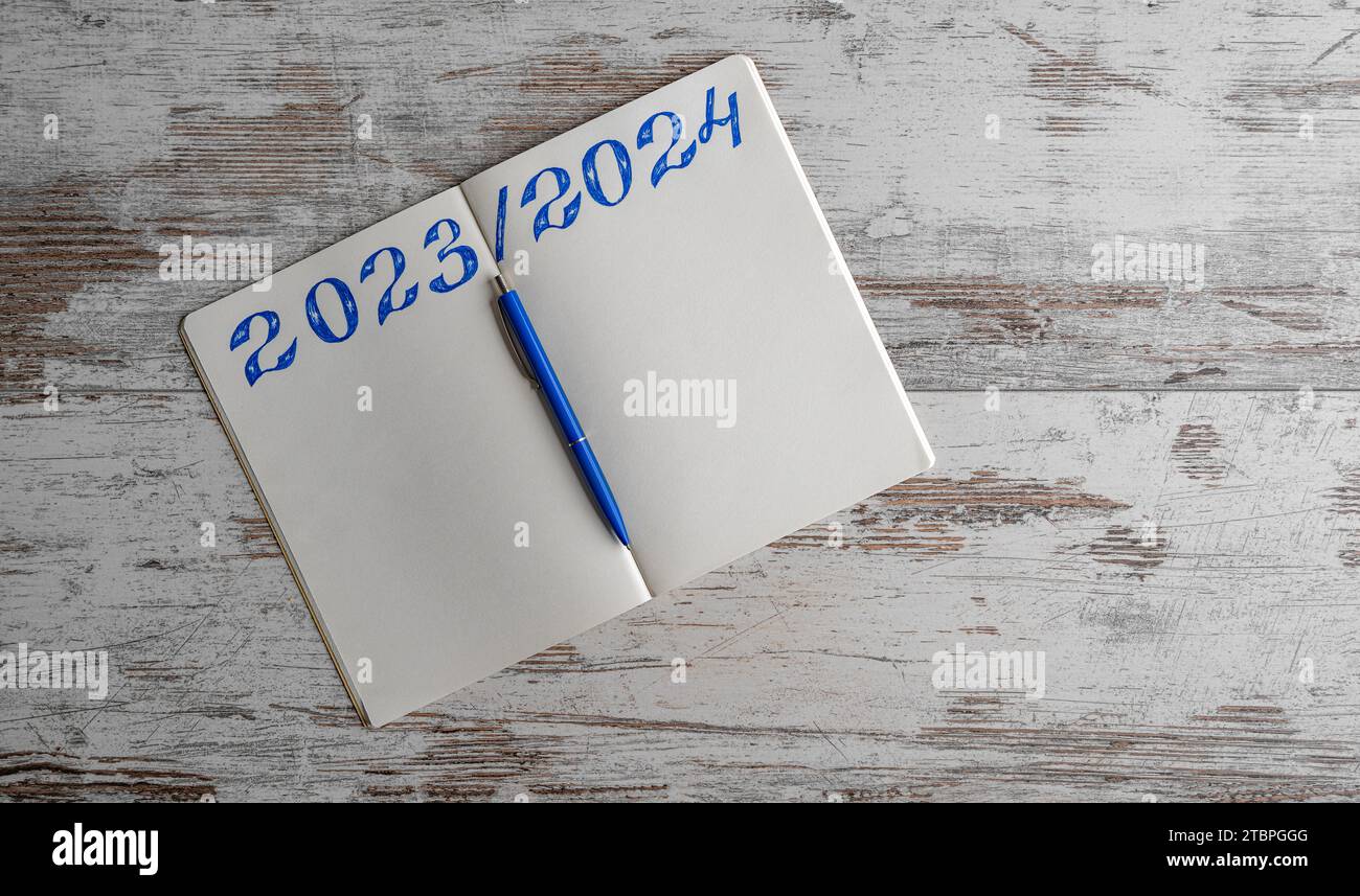Notepad with dates 2023 and 2024 Stock Photo - Alamy