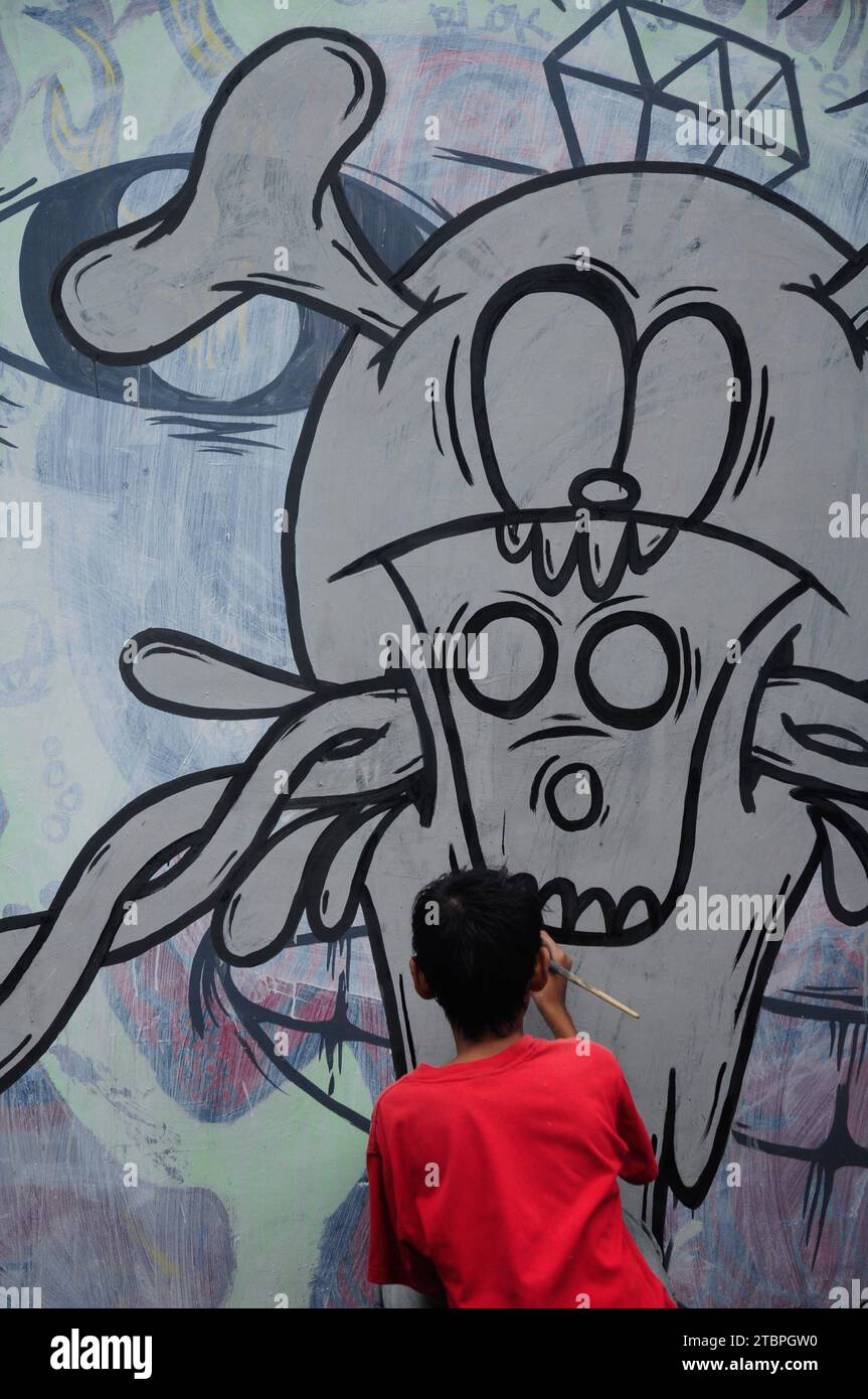 Yogyakarta, Java - May 26, 2019: Indonesian boys painting the walls of ...