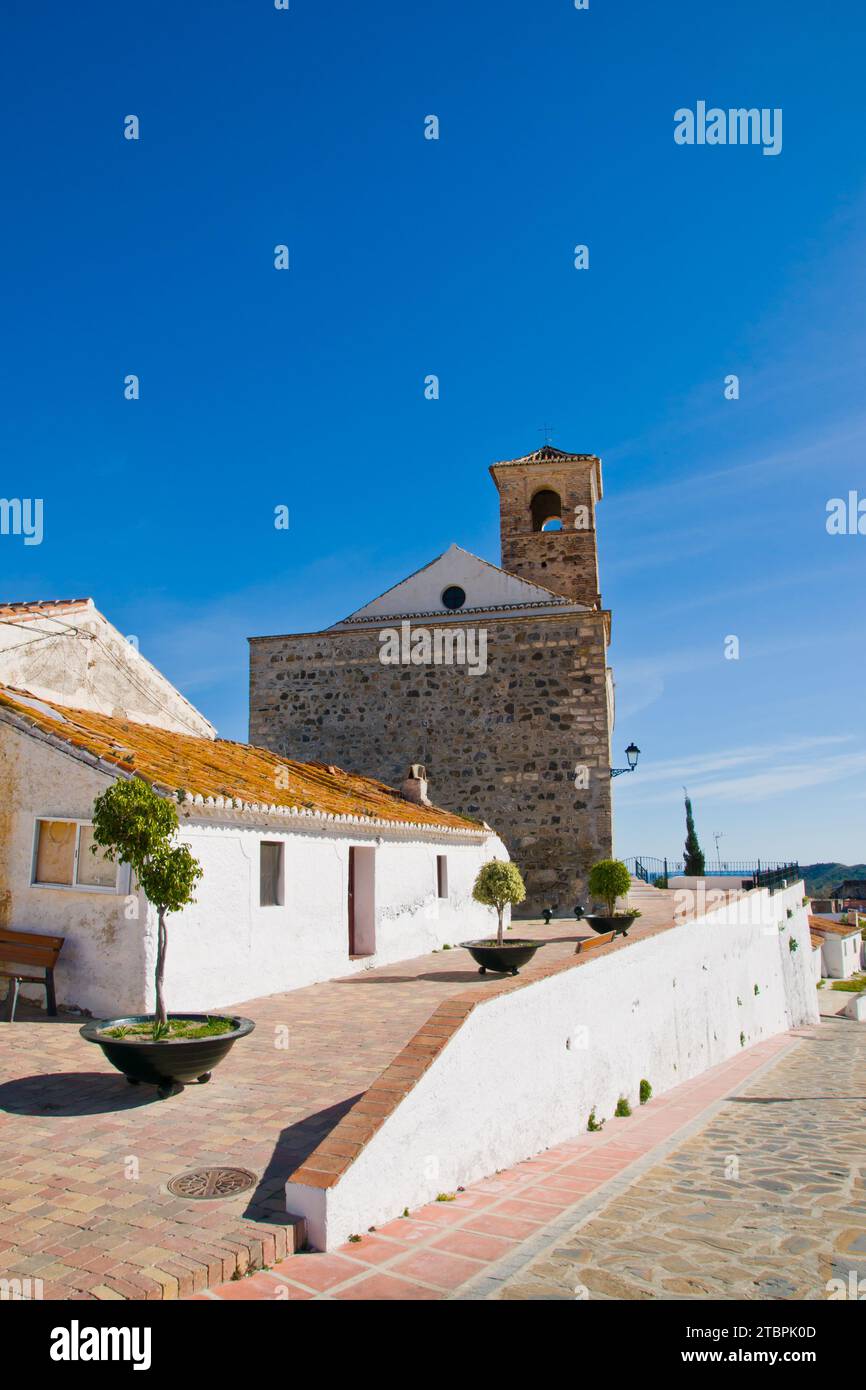 A large two-story white house with a brick pathway leading up to its ...