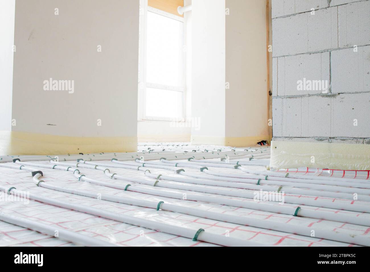 Installation of underfloor heating pipes for water heating. Heating systems. Pipes for ...