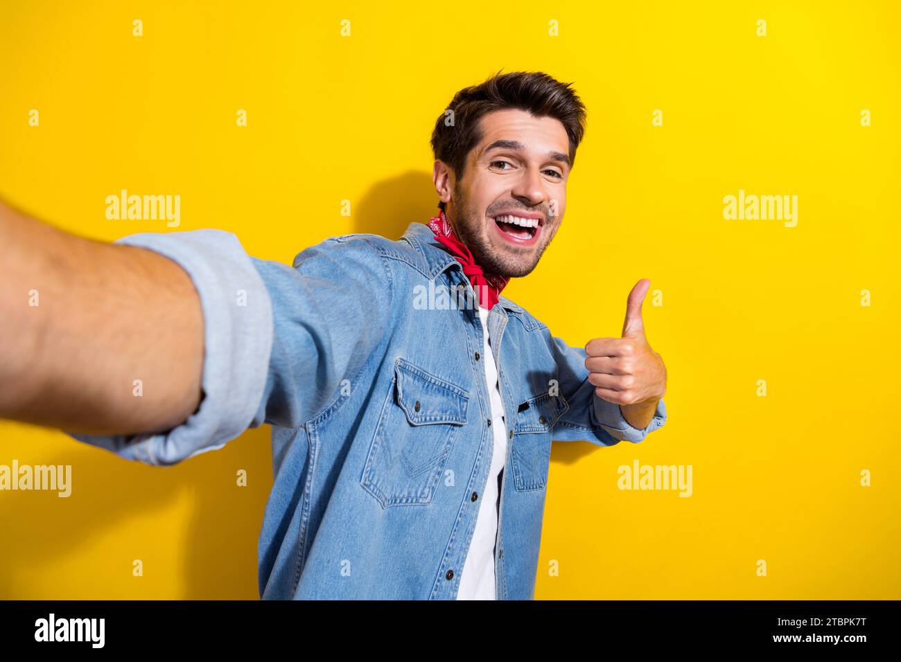 Photo portrait of attractive young man take selfie show thumb up dressed stylish denim clothes ...