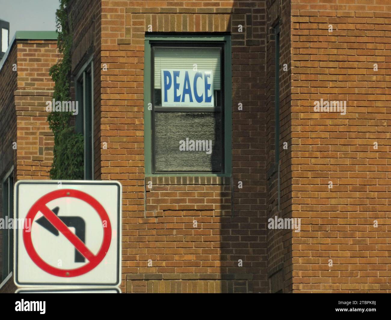 Signs posted on the side of buildings prohibiting a right turn with a ...