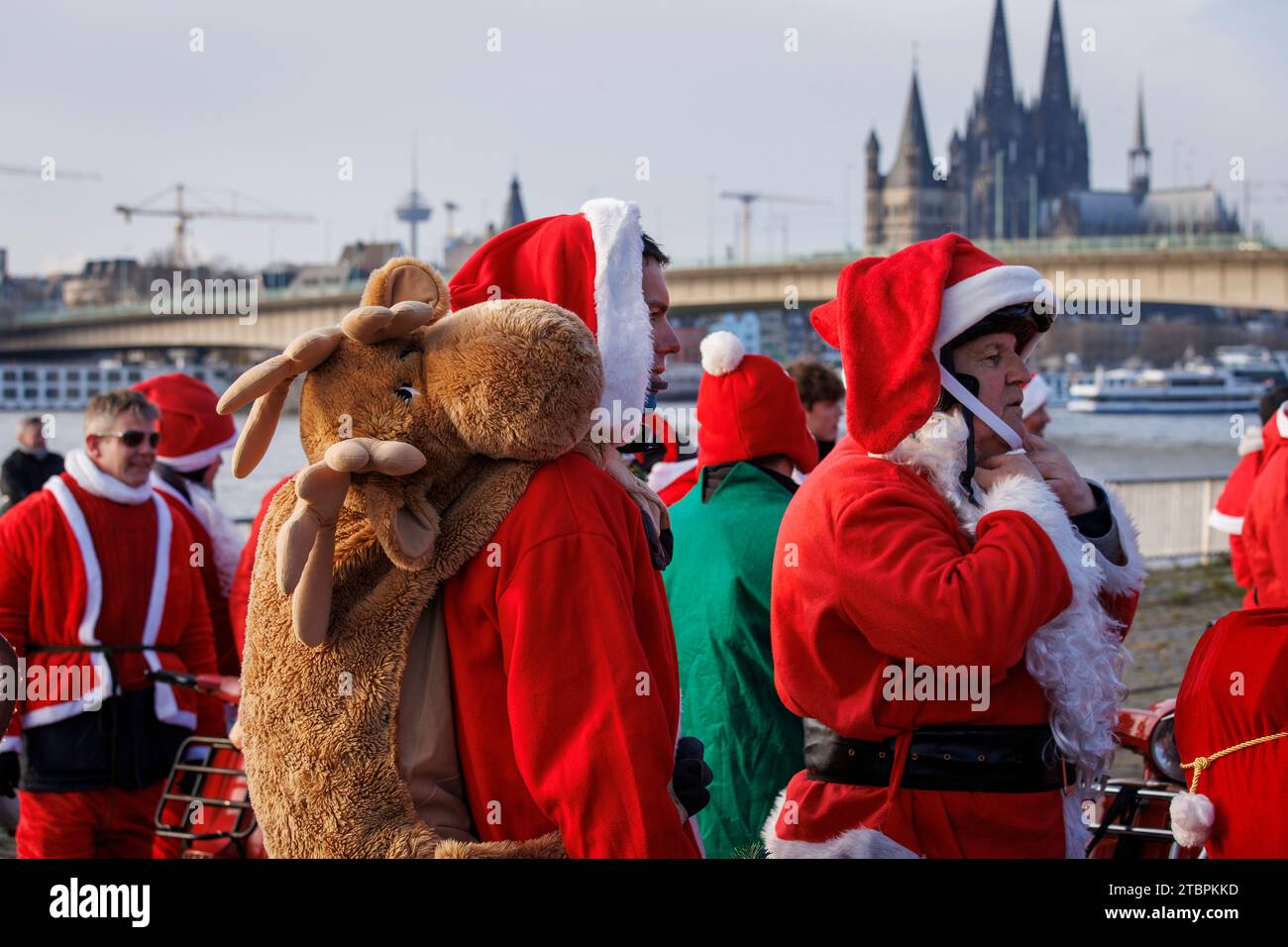 members of the Vespa scooter club RheinSchalter Koeln dressed as Santas ...