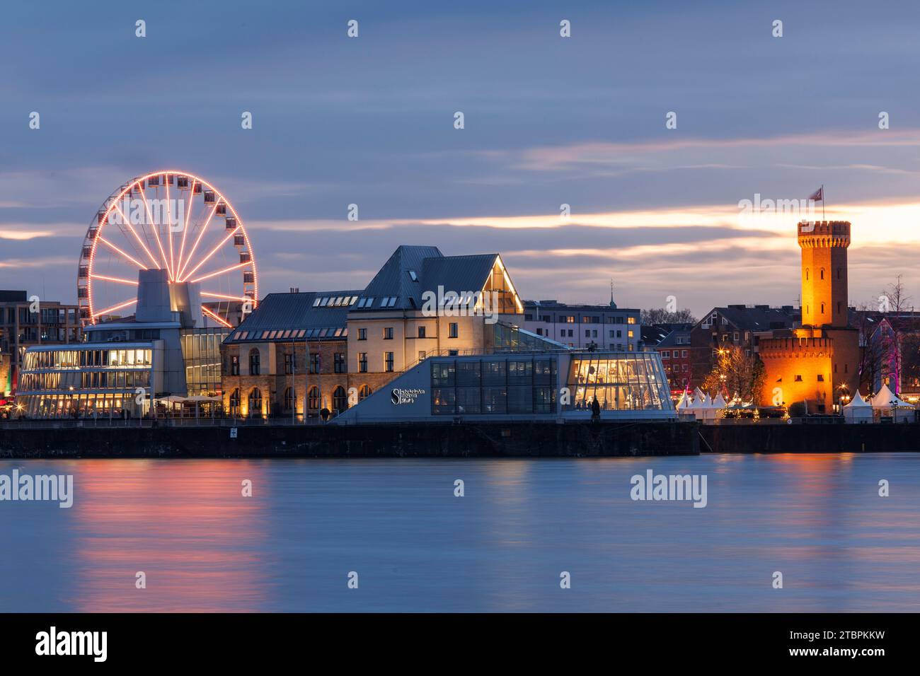 view over the Rhine to the ferris wheel at the Chocolate Museum in the ...