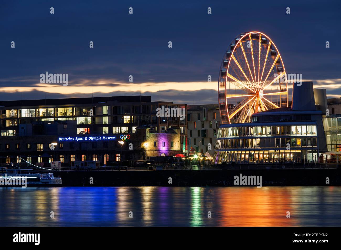 view over the Rhine to the ferris wheel at the Chocolate Museum in the ...