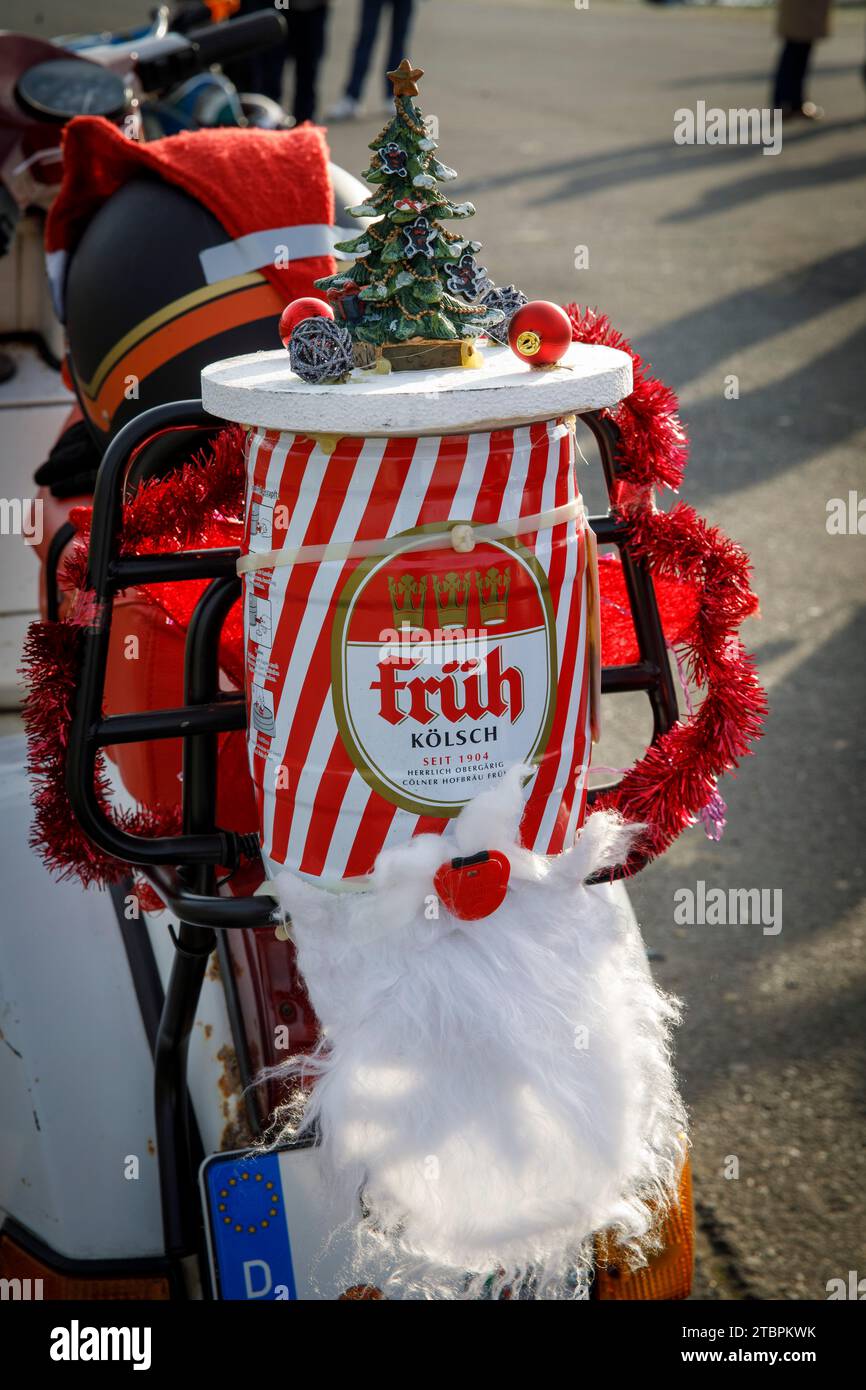 Christmas decorated Vespa scooter, small beer keg, members of the Vespa ...