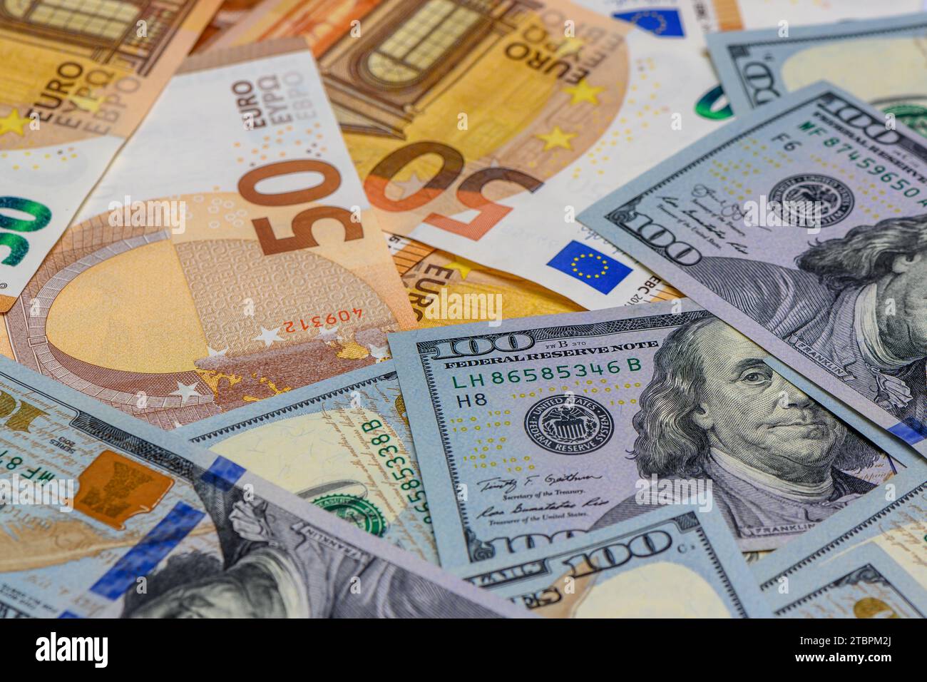 50 euro and 100 dollar bills scattered on the table as a background Stock Photo - Alamy