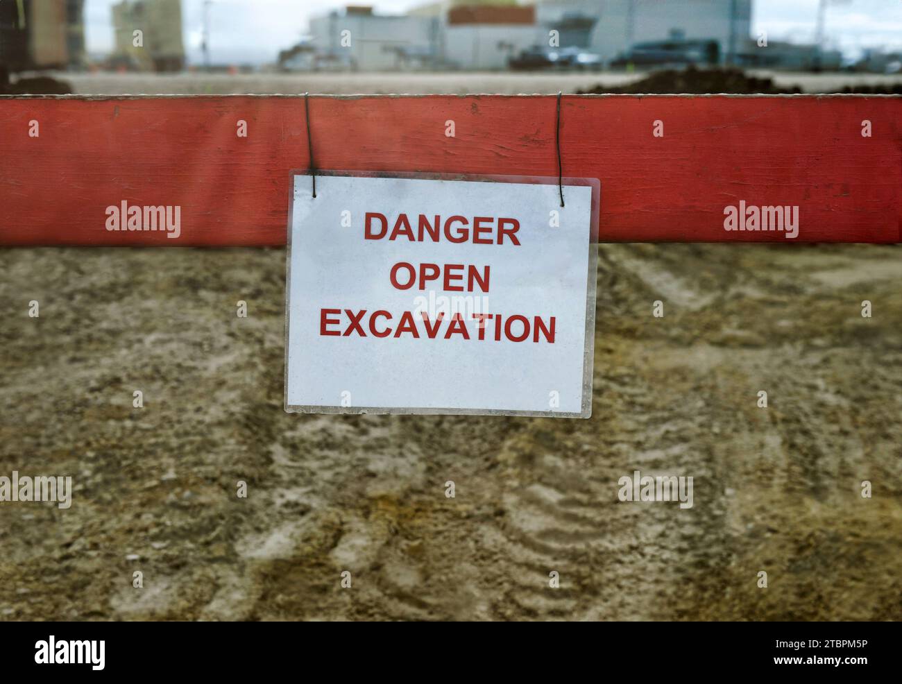 A vivid red warning sign with the text 'Danger Open Excavation' Stock ...