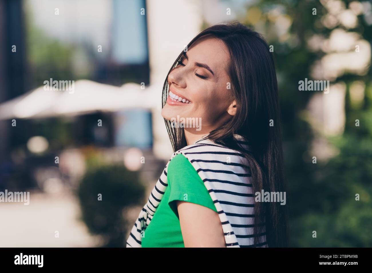 Photo of shiny dreamy girl dressed green top enjoying sunshine closed ...