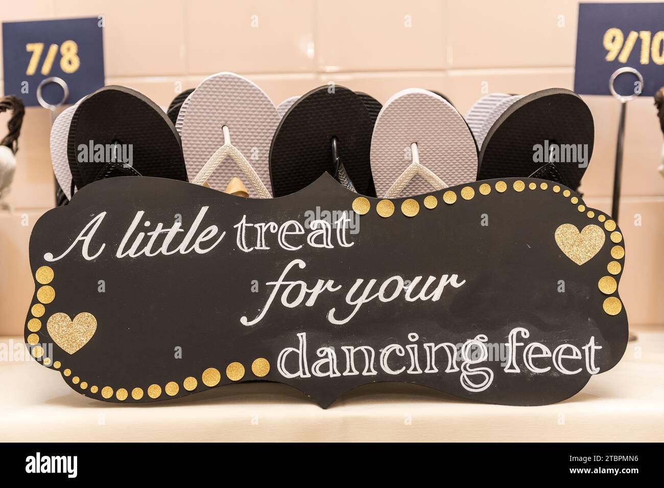 A sign reading 'A little treat for your dancing feet' in front of a ...