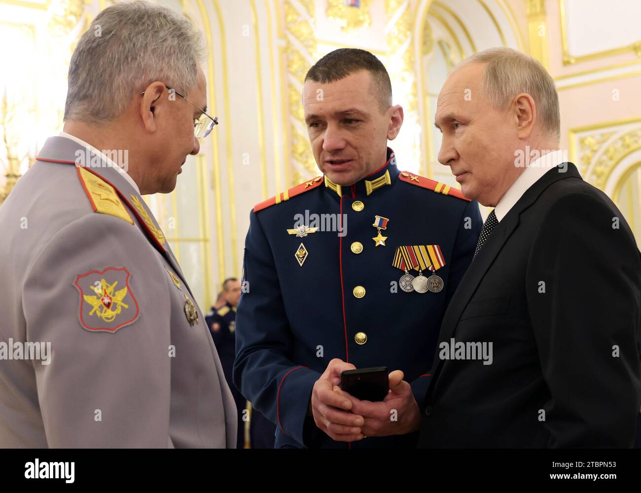 Russian President Vladimir Putin, right, talks with Russian Defense Minister Sergei Shoigu, left ...