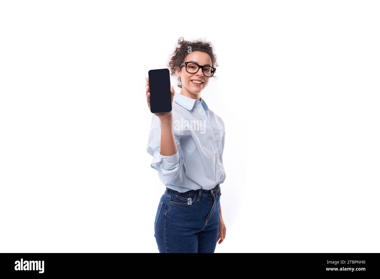 portrait of a young smart brunette assistant lady dressed in a basic ...
