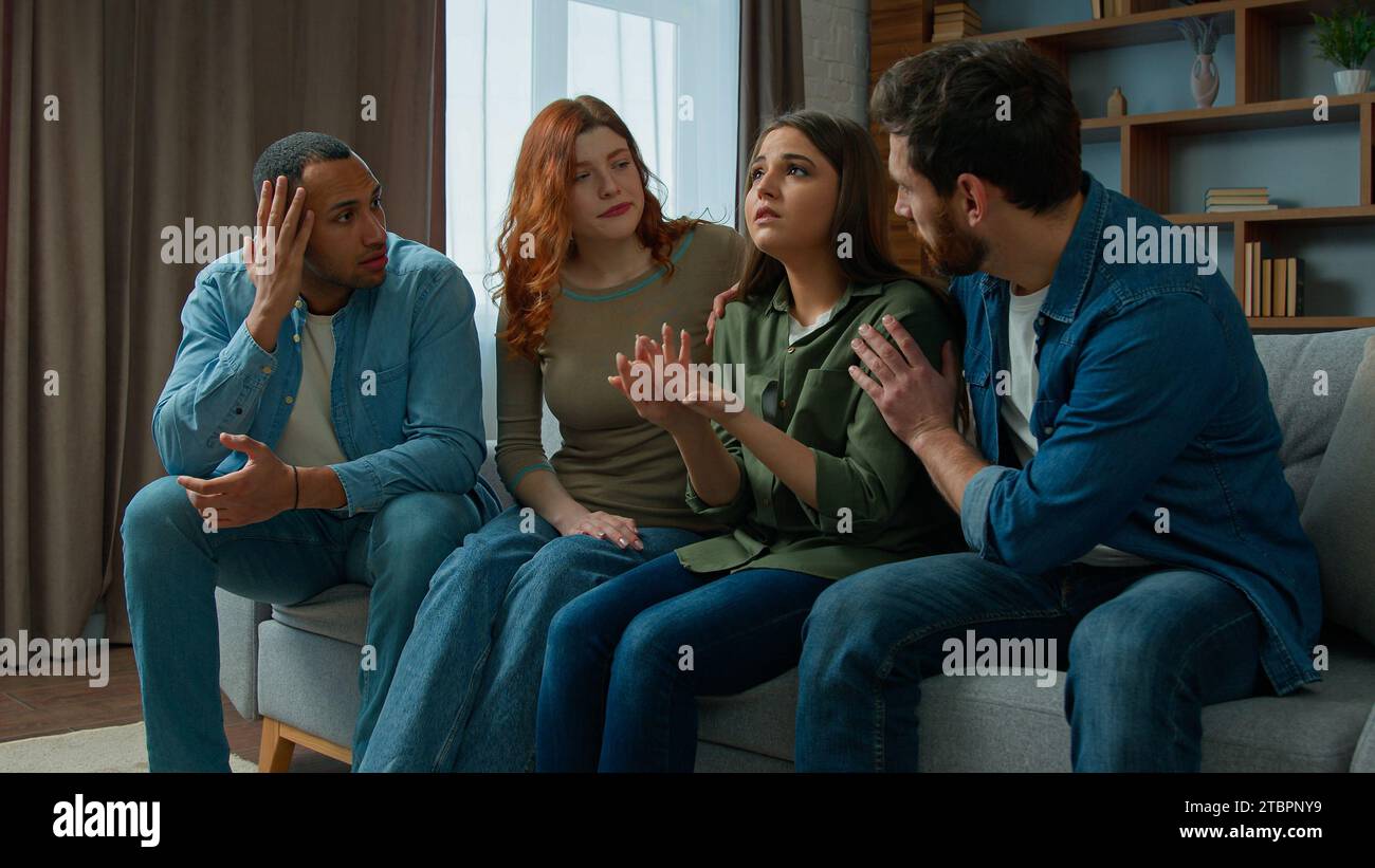 Multiracial 30s diverse people sit indoors sad crying woman sharing ...