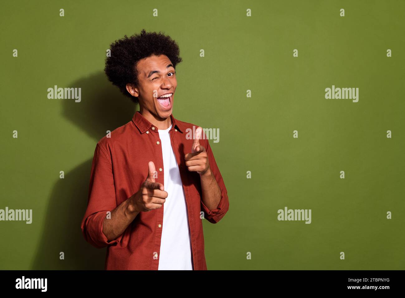 Photo portrait of handsome young guy wink eye point you excited dressed ...