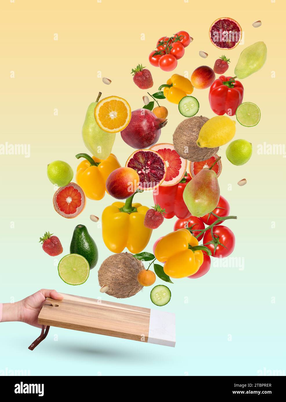 Levitating fruits and vegetables over a wooden kitchen board. Healthy ...