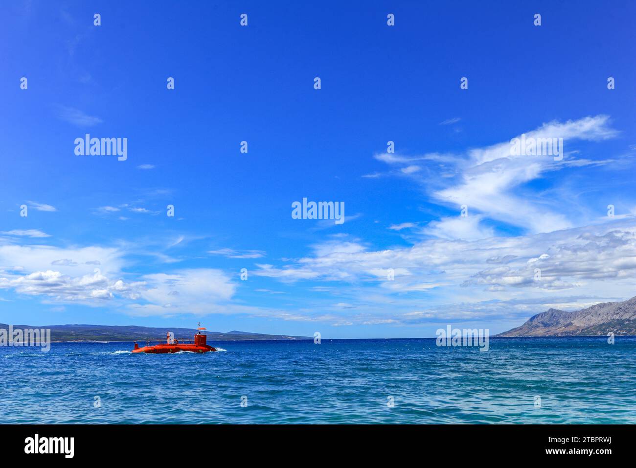 Red submarine against the background of the Adriatic Sea tourist ...