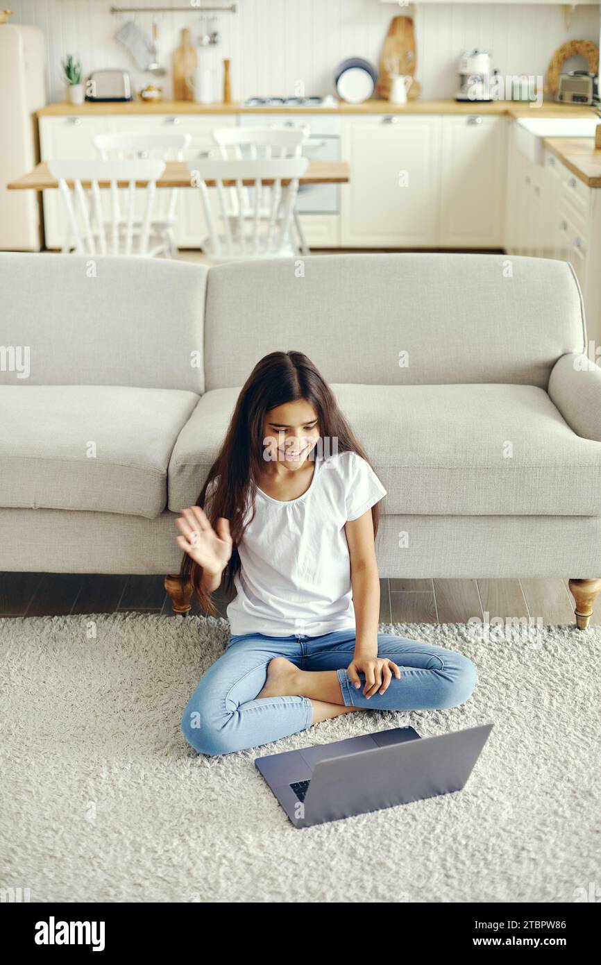 Attractive middle-eastern ethnicity pre-teen 12s girl sit on floor in ...