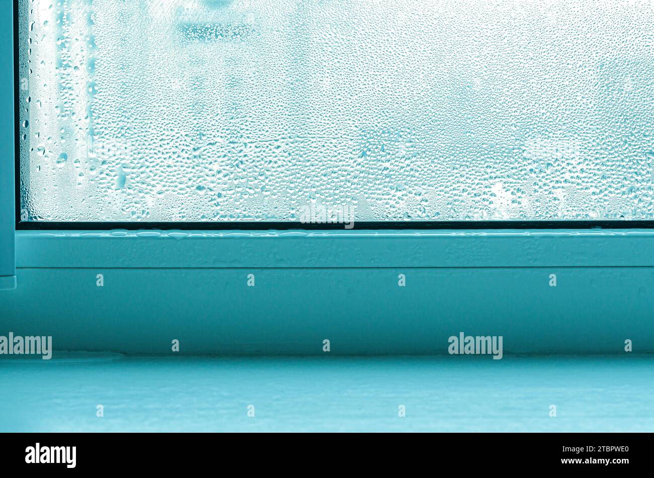 Greenhouse effect. Drops of condensation on a metal-plastic window ...