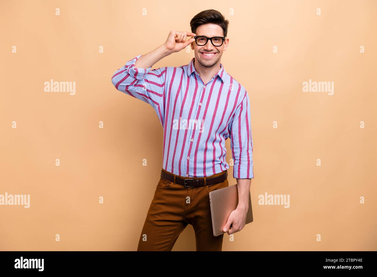 Photo of smiling system administrator man in office touching his ...