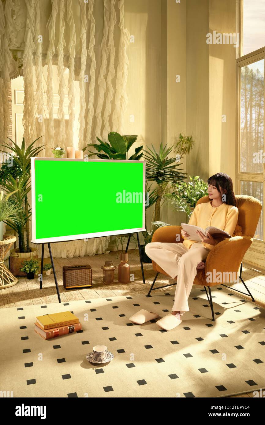 People are watching and enjoying next to the TV, monitor with green ...