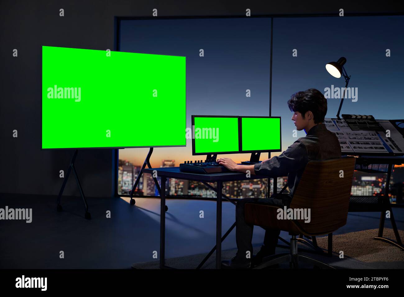 People are watching and enjoying next to the TV, monitor with green ...