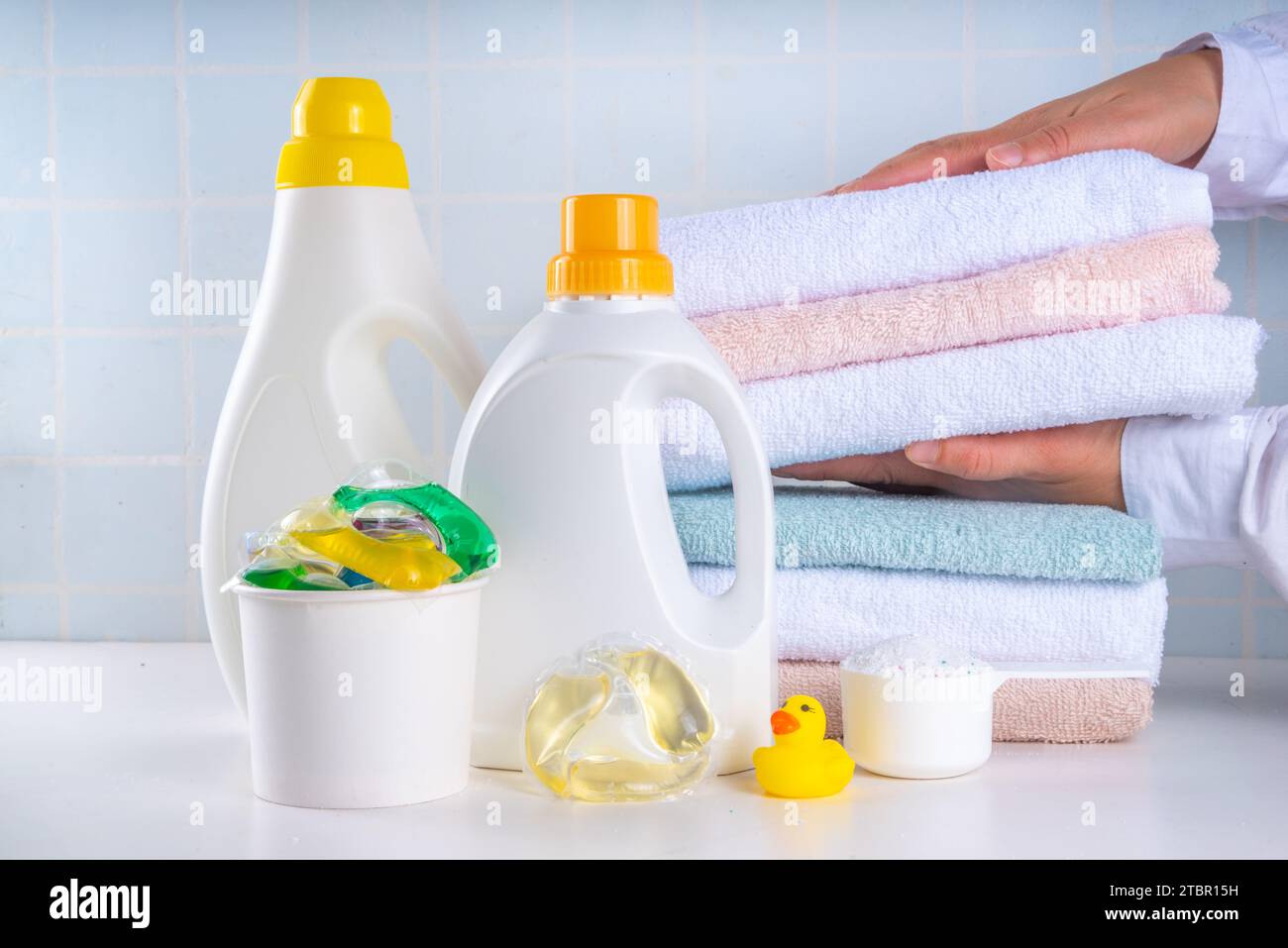 Laundry, washing and cleaning concept. Stack of clean towels, with ...