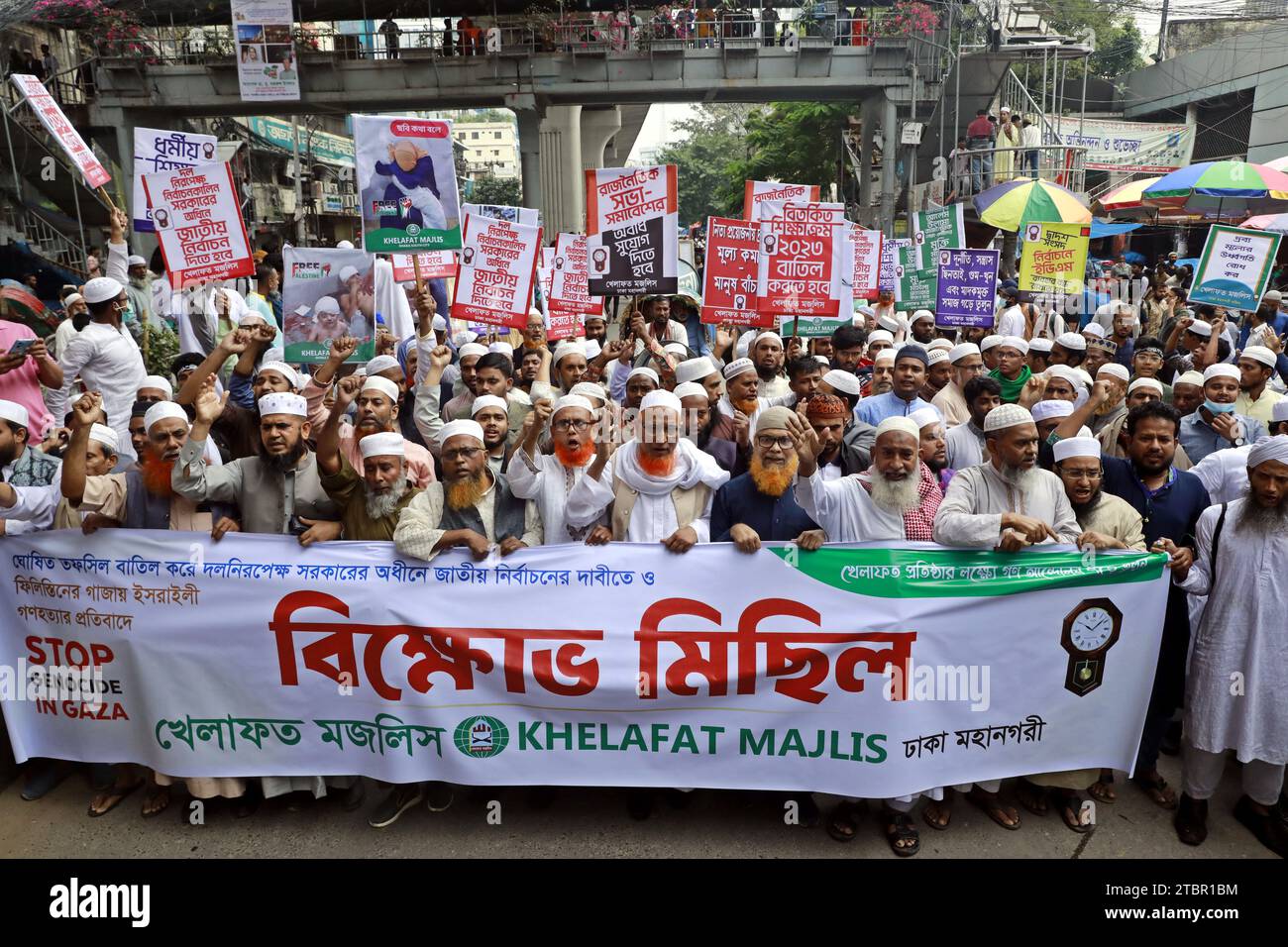 Members and supporters of the Islamic Activities Group Bangladesh political take part in a ...