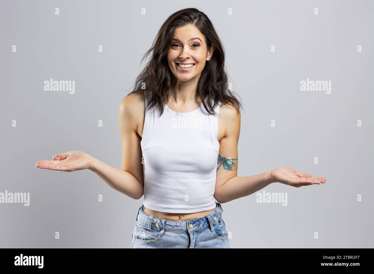 Beautiful Happy Brunette Woman Spreading Her Arms To The Side Isolated