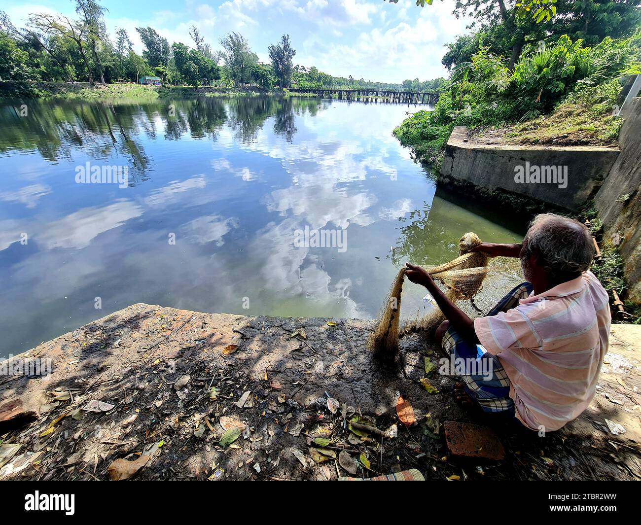 A fishermen catching fishing with fishing net at the remote village of ...