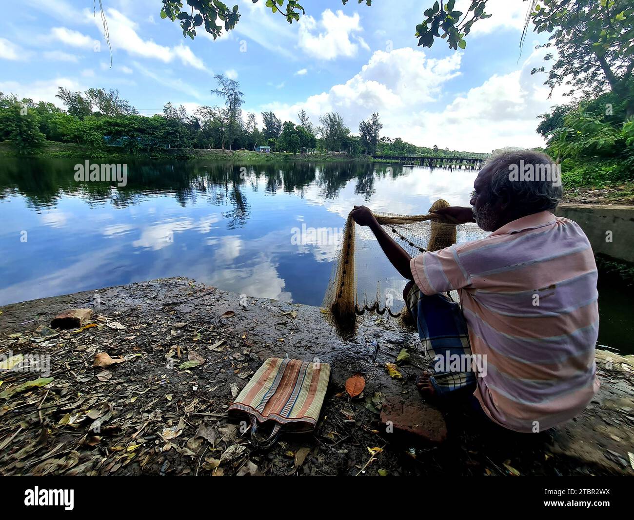 A fishermen catching fishing with fishing net at the remote village of ...