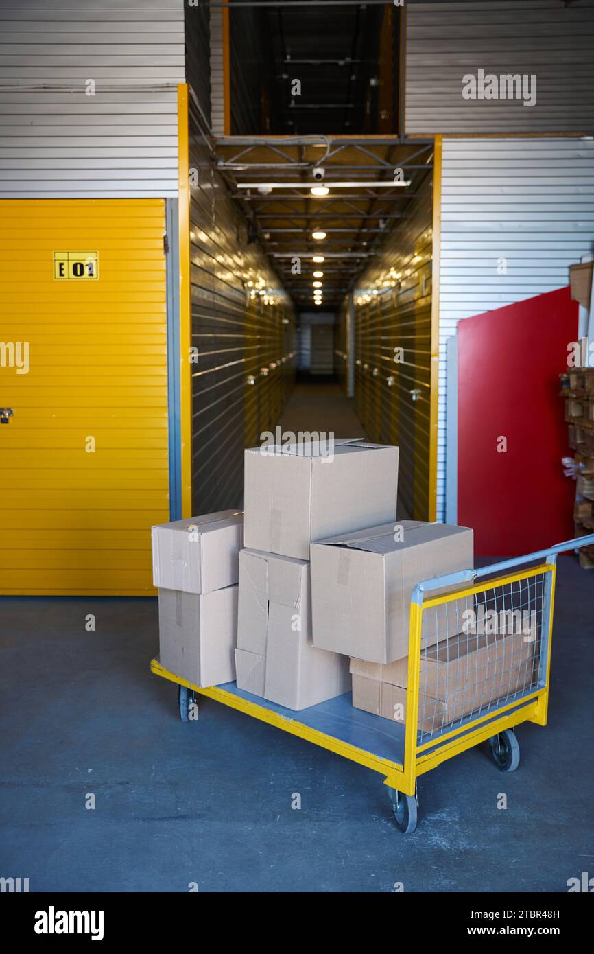 Cargo trolley on small wheels stands near the containers Stock Photo ...