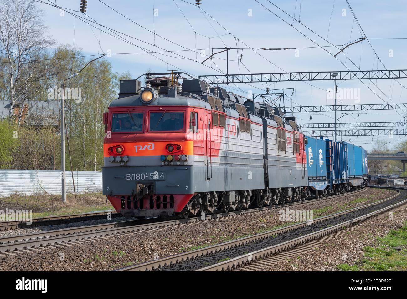 SHARYA, RUSSIA - APRIL 30, 2023: Electric locomotive VL80s with a ...