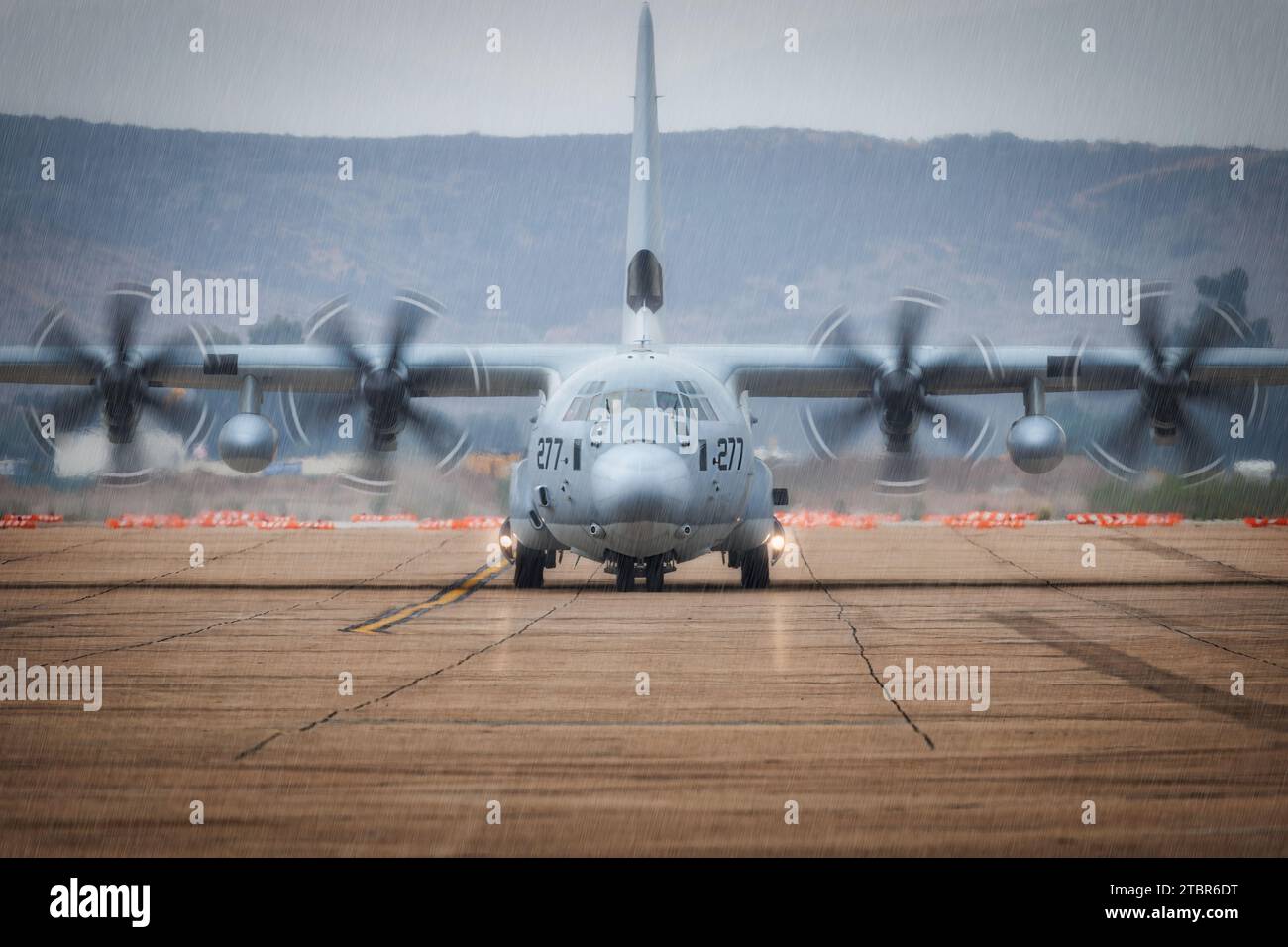 A C-130 Hercules stands on the rain on the tarmca at America's Airshow ...