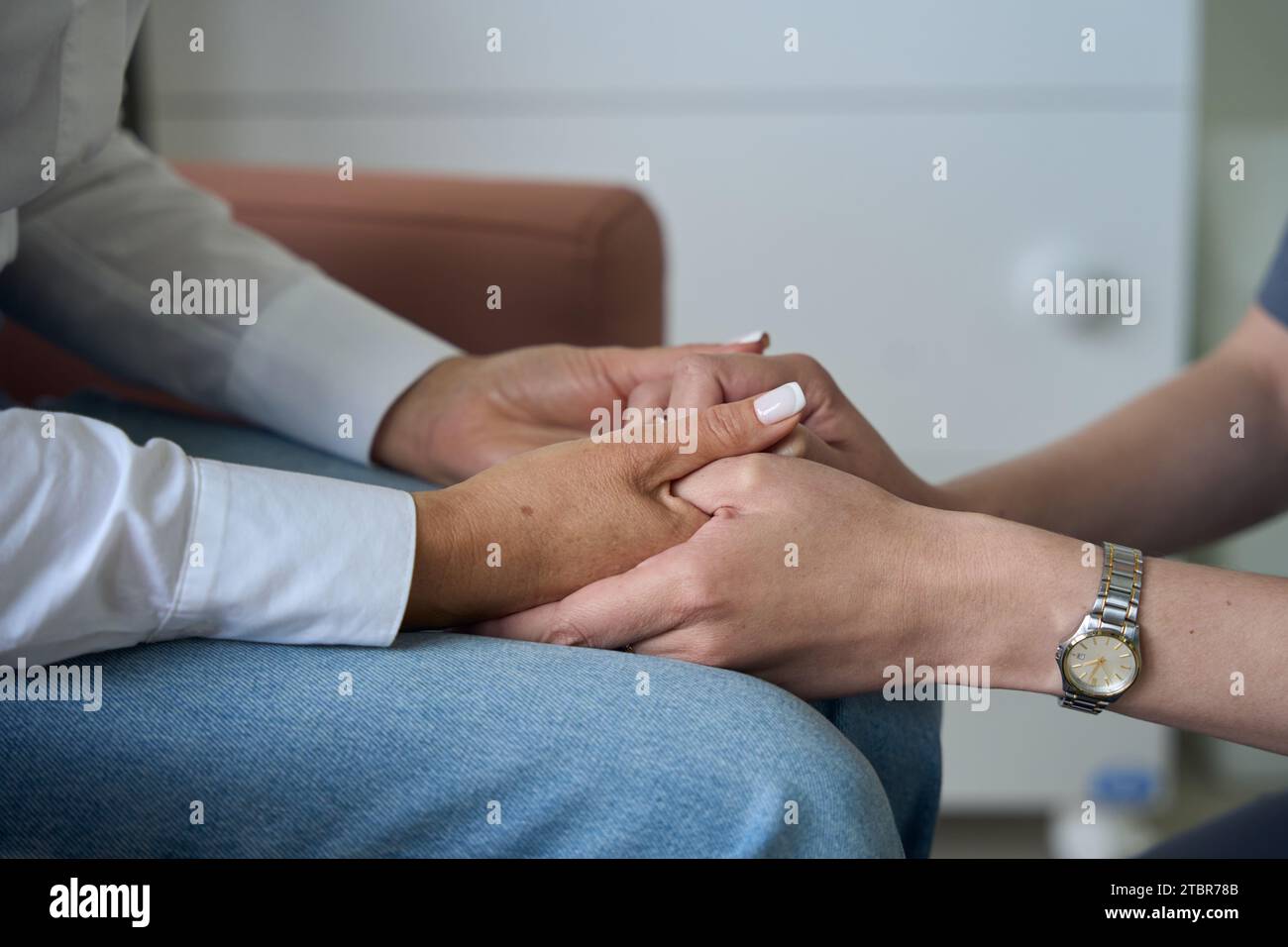 Caring general practitioner giving comfort to patient Stock Photo - Alamy