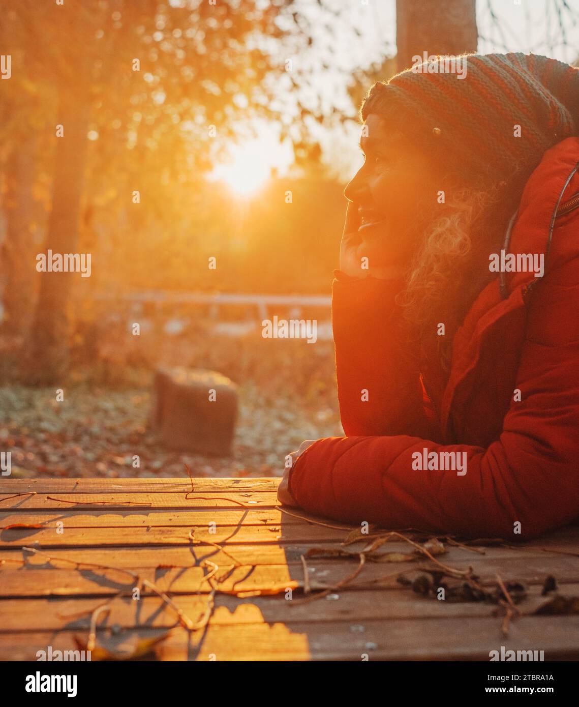 Side portrait view of young woman relaxing and thinking happy smiling ...