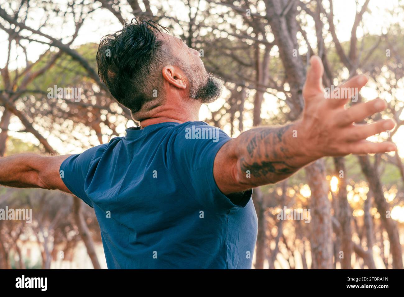 Man with freedom and nature love concept lifestyle opening arms to hug ...