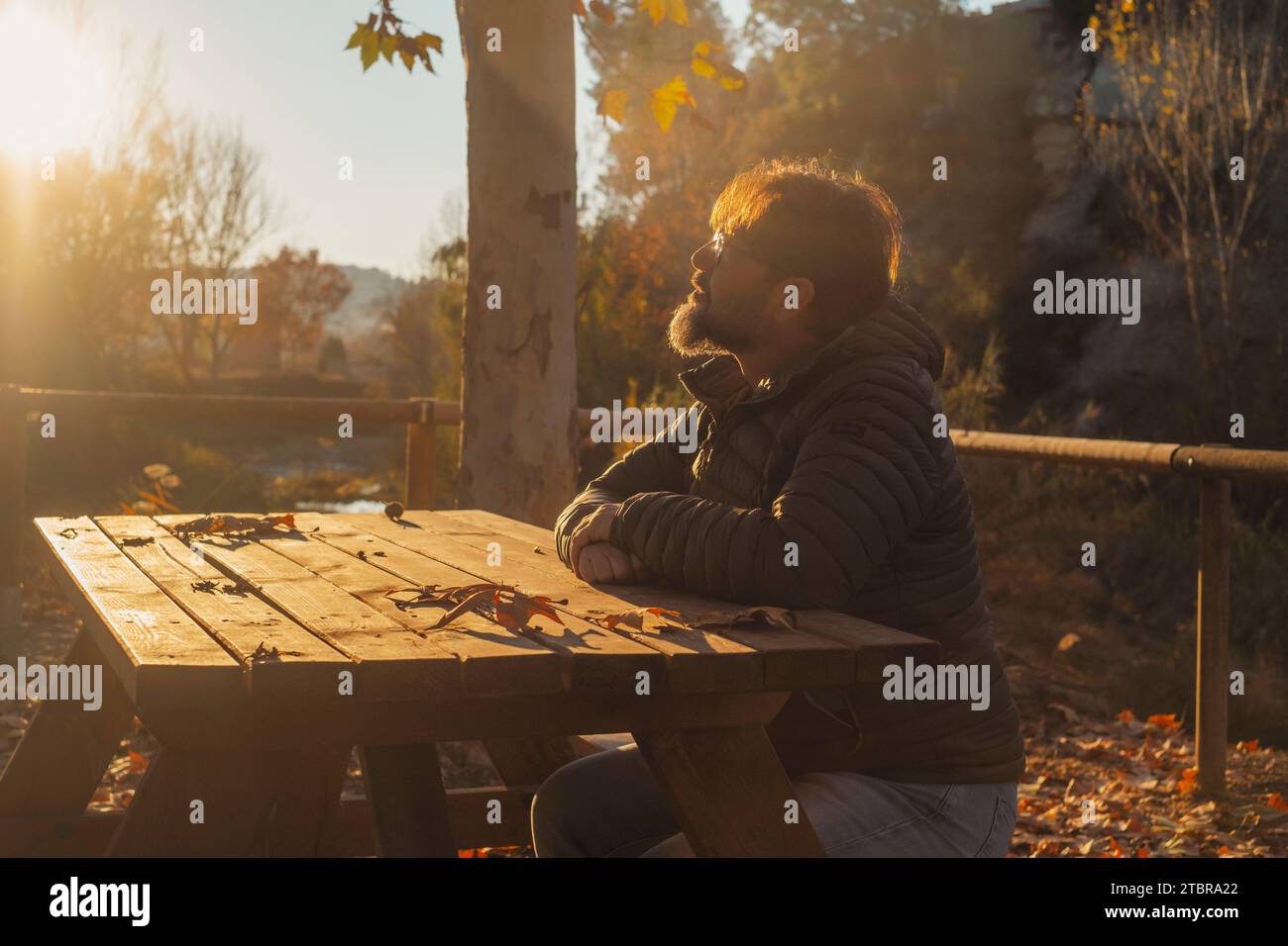 One man alone admire and enjoy a golden beautiful sunset outdoor ...