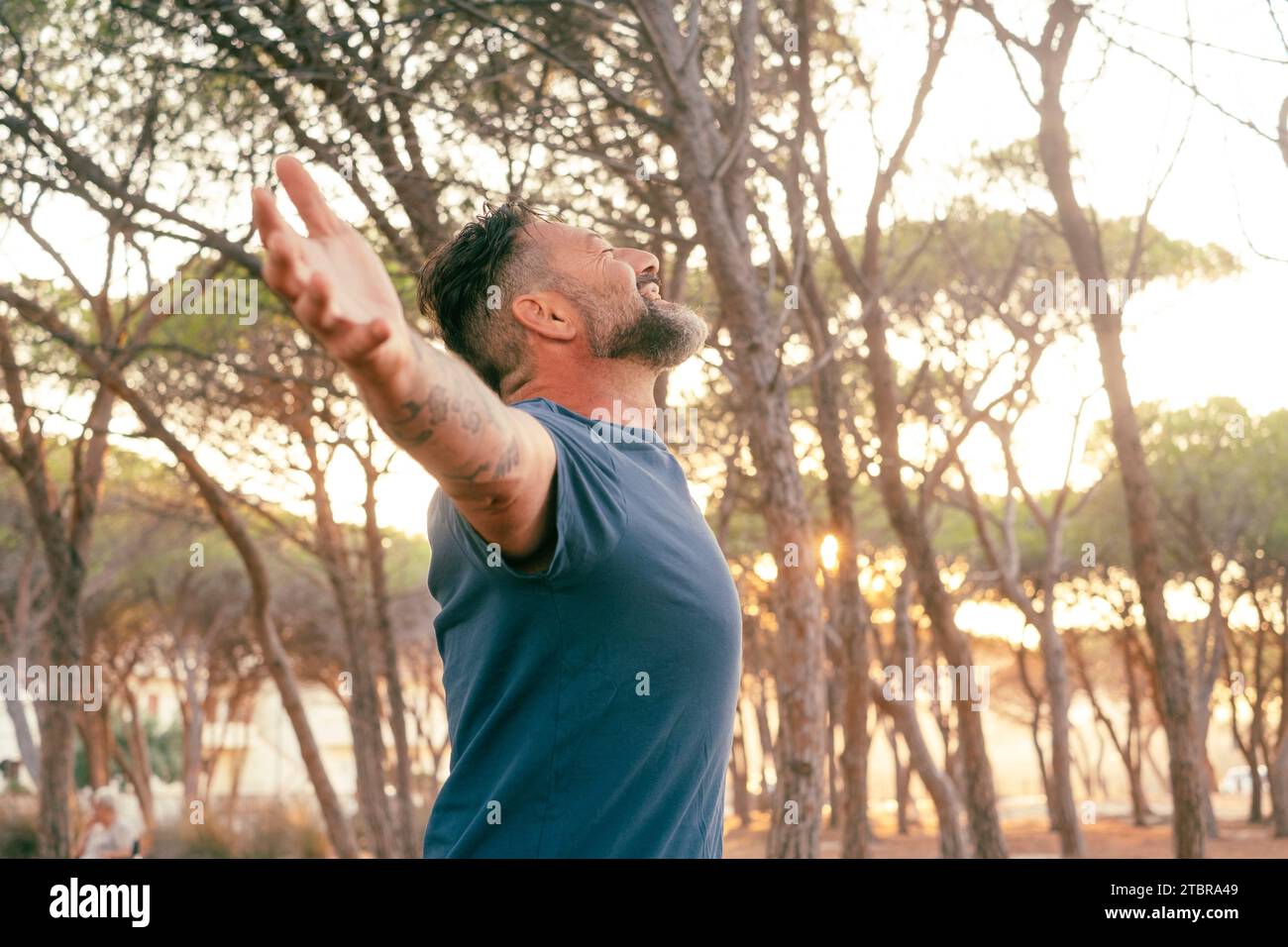 Man with freedom and nature love concept lifestyle opening arms to hug ...